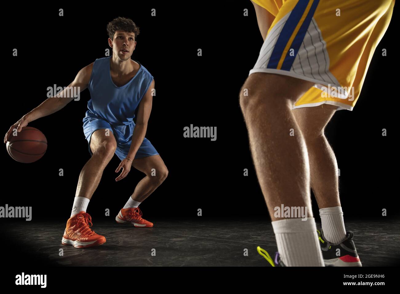 Competitive sport. Two male athletes, professional basketball players ...