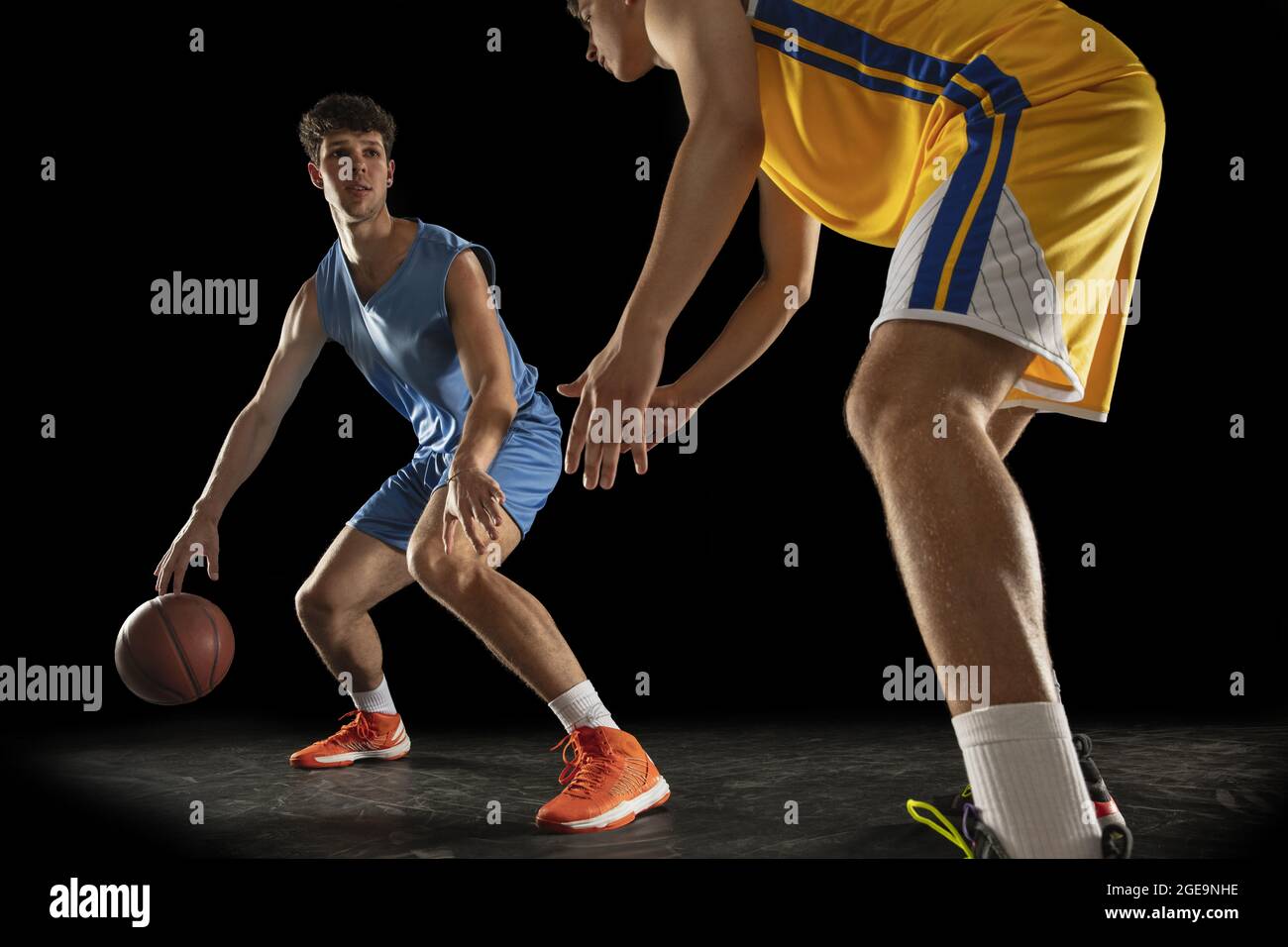 Competitive sport. Two male athletes, professional basketball players ...