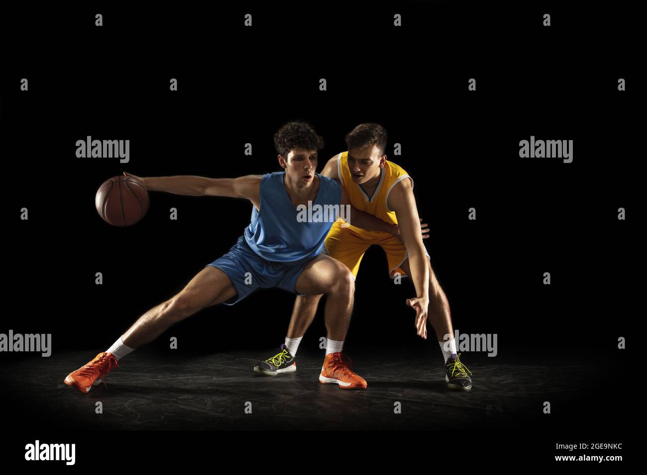 Competitive sport. Two male athletes, professional basketball players ...