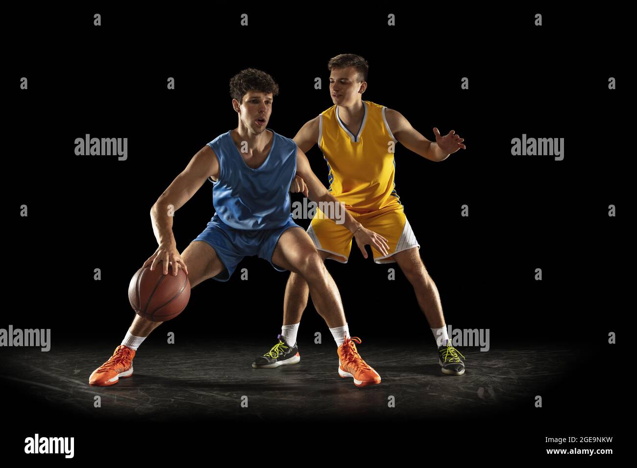 Competitive sport. Two male athletes, professional basketball players ...