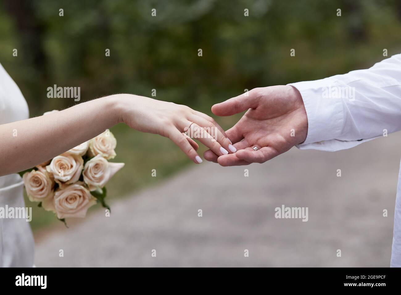 Hand to hand by wedding couple based on Michelangelo. Elegant wedding ...