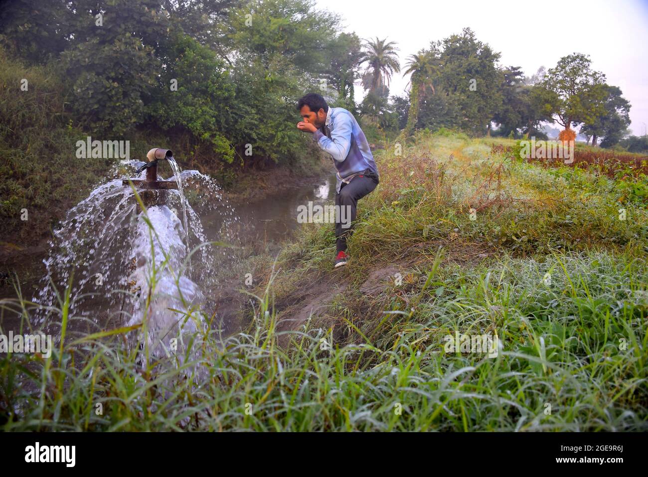 Agricultural equipment for field irrigation, an Indian farmer drinking ...