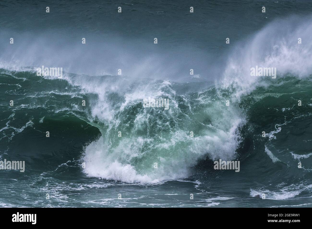 A wild wave breaking on the Cribbar Reef off Towan Head in Newquay in ...