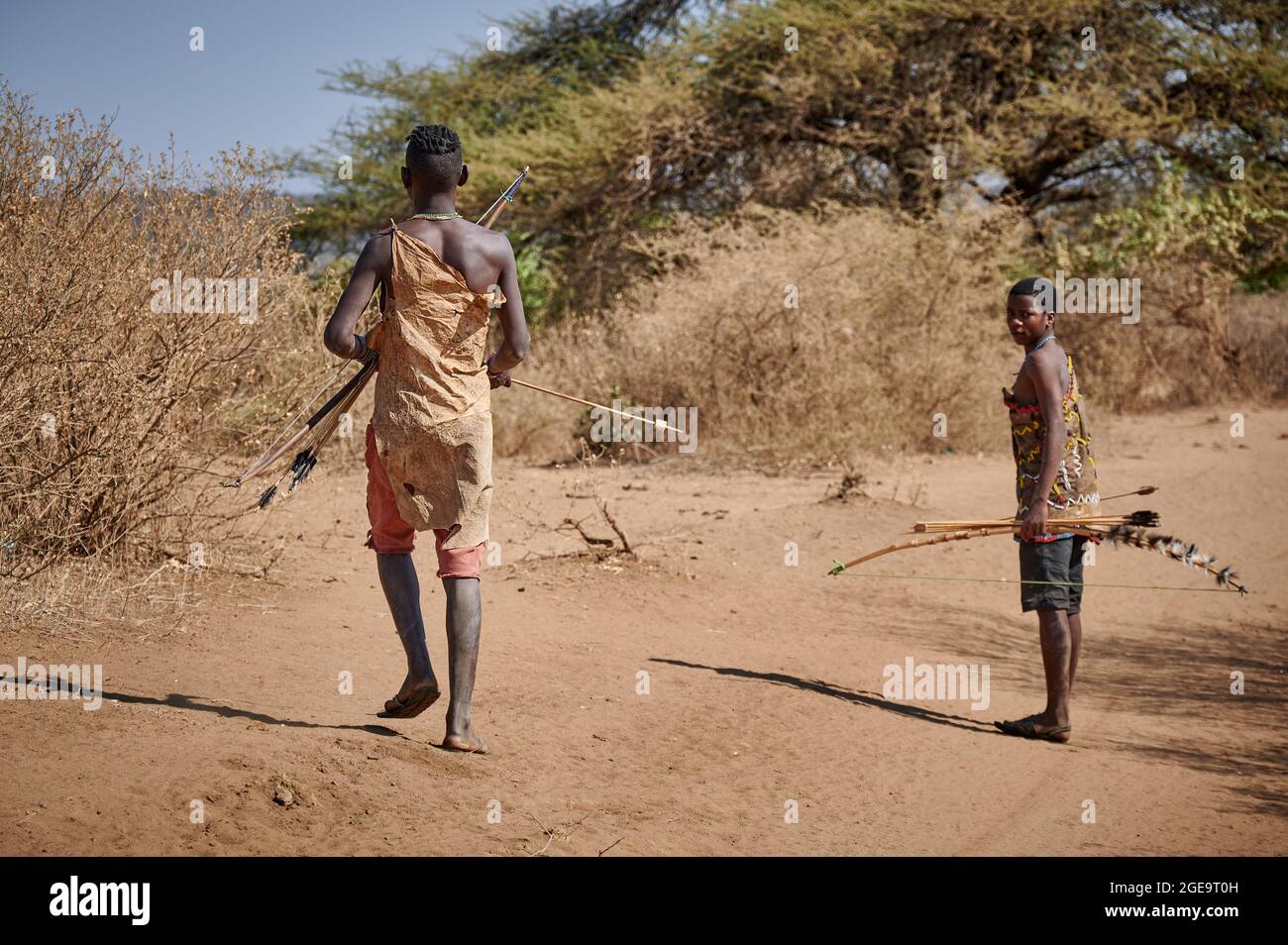 hunting bushmen of Hadzabe tribe with bow and arrow, Lake Eyasi ...