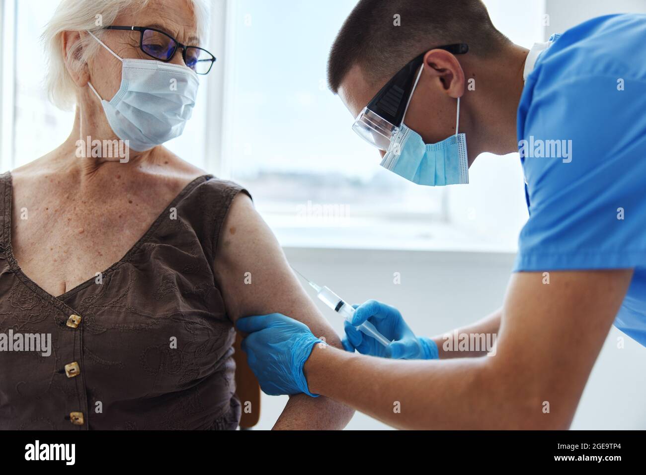 elderly woman in hospital immunity protection in medical masks Stock ...