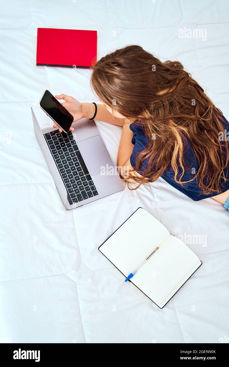 Teenage woman laptop back view hi-res stock photography and images - Alamy