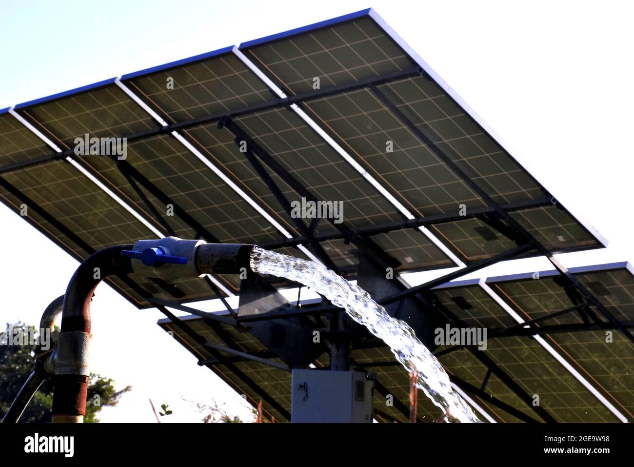 agricultural equipment for field irrigation, water jet, behind which is ...