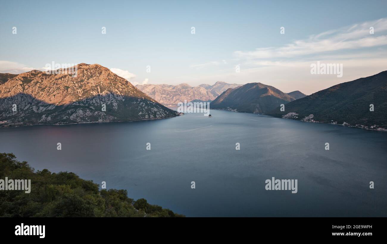 Aerial view of Boka Bay with peaceful water and mountains under a clear ...