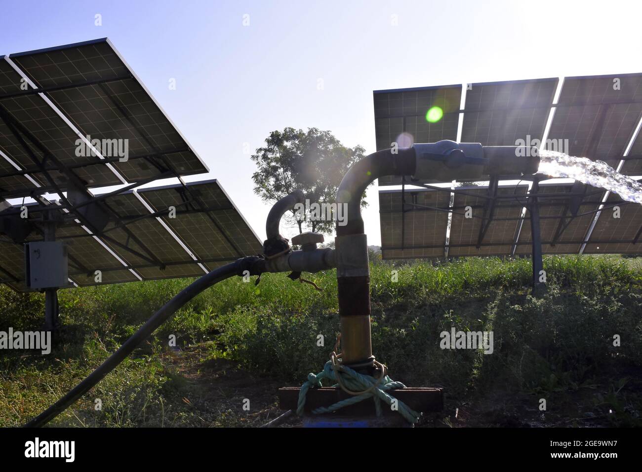agricultural equipment for field irrigation, water jet, behind which is ...
