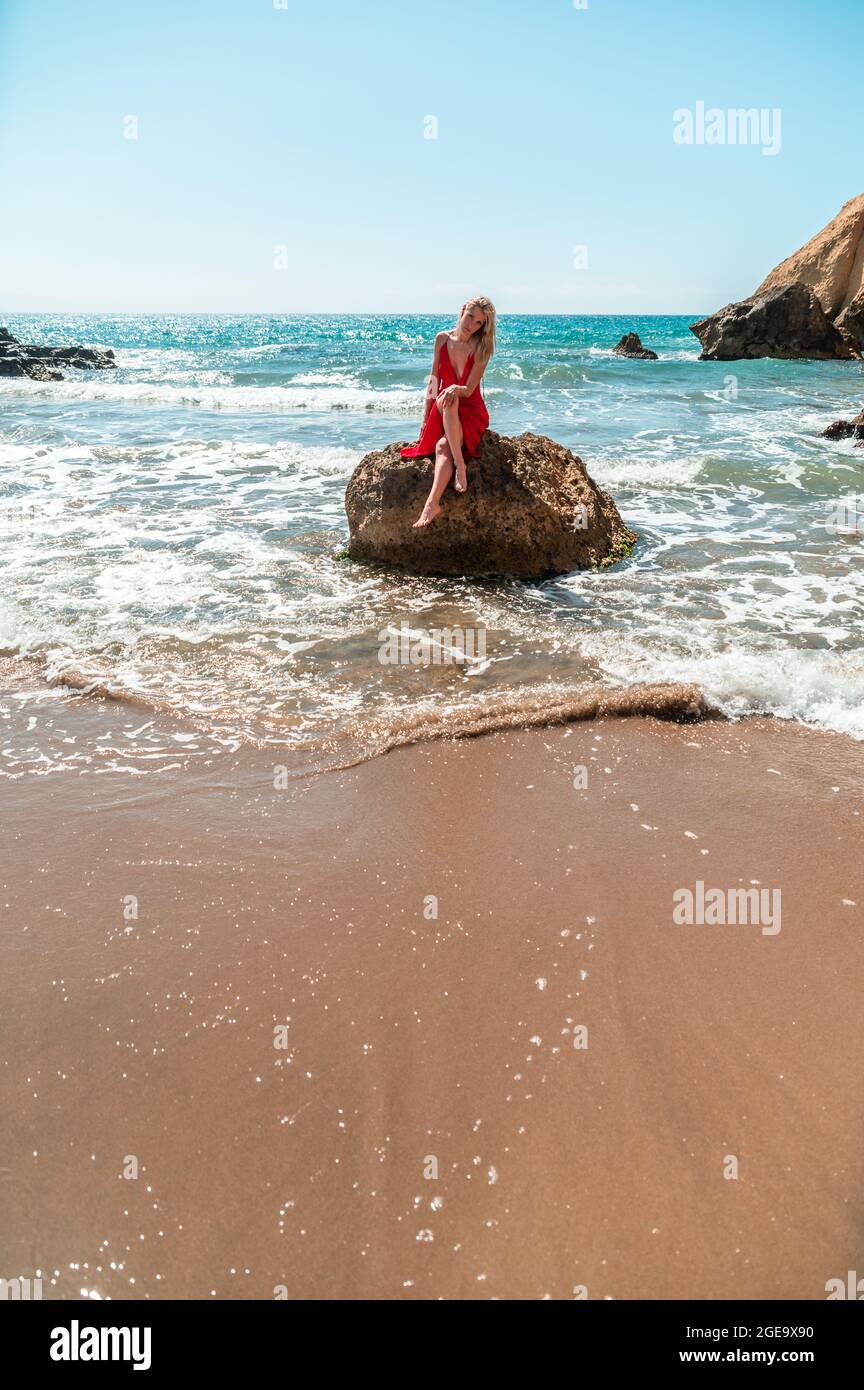 Full body side view of tranquil pensive young female in casual outfit ...