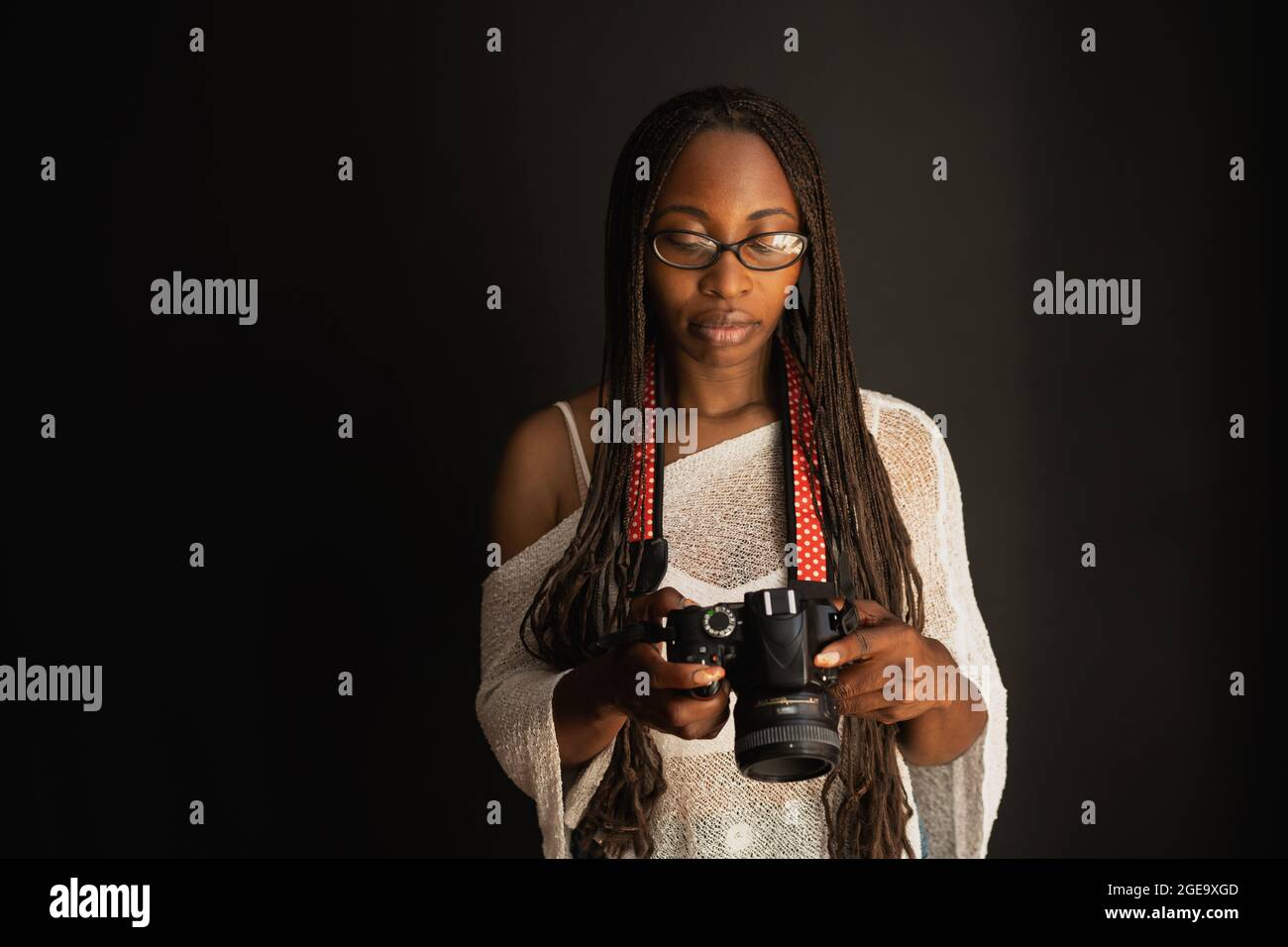 Back view of unrecognizable female standing on top of rocky mountain ...