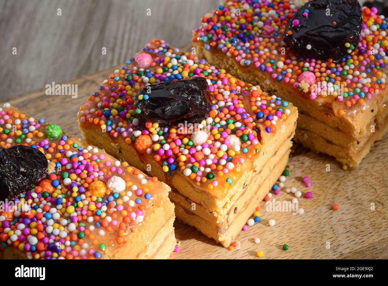 From above of sweet Turron de Dona Pepa cakes with nougat decorated ...
