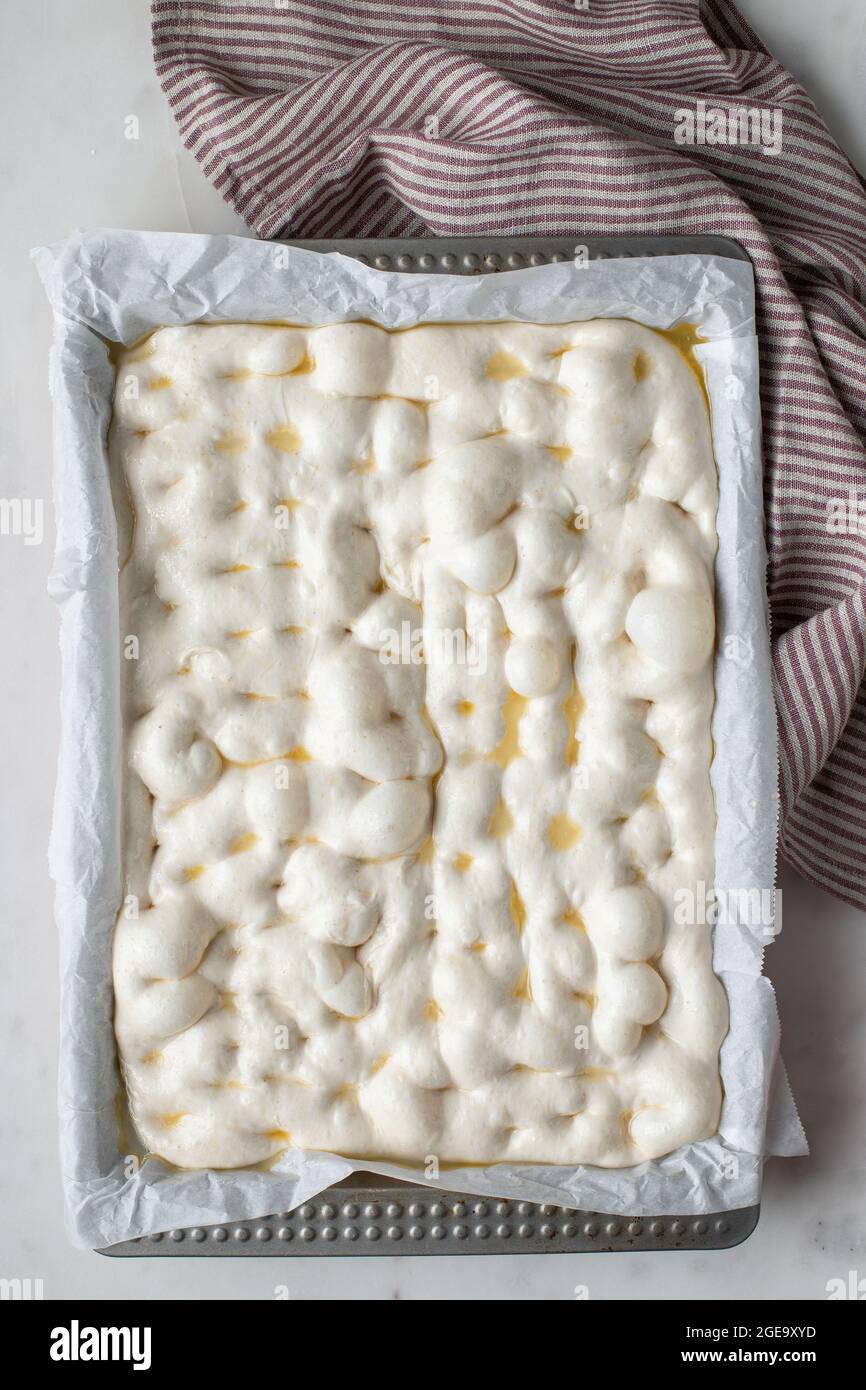 Top view of homemade dough placed on baking paper for cooking ...