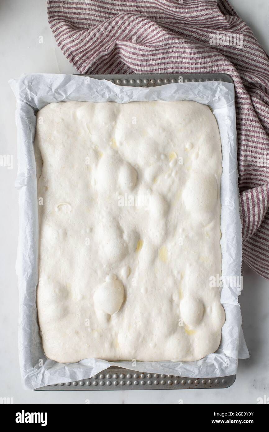 Top view of homemade dough placed on baking paper for cooking ...