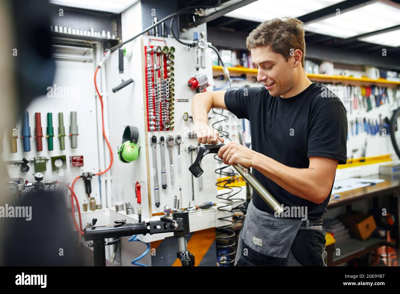 Cheerful male master fixing hi-res stock photography and images - Alamy