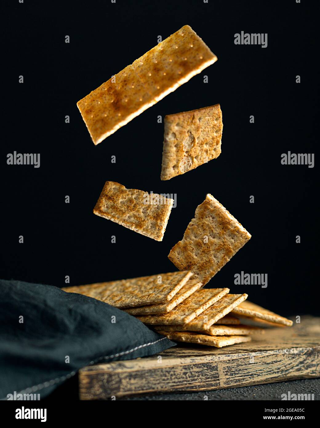 Creative concept with falling food on black backdrop Stock Photo - Alamy