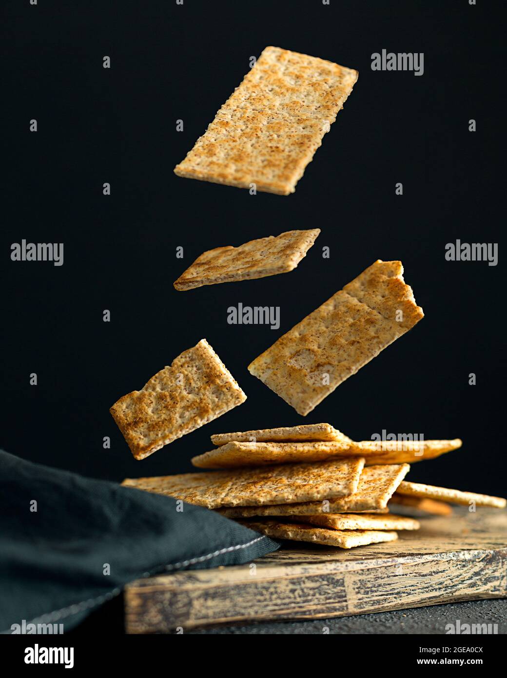 Creative concept with falling food on black backdrop Stock Photo - Alamy