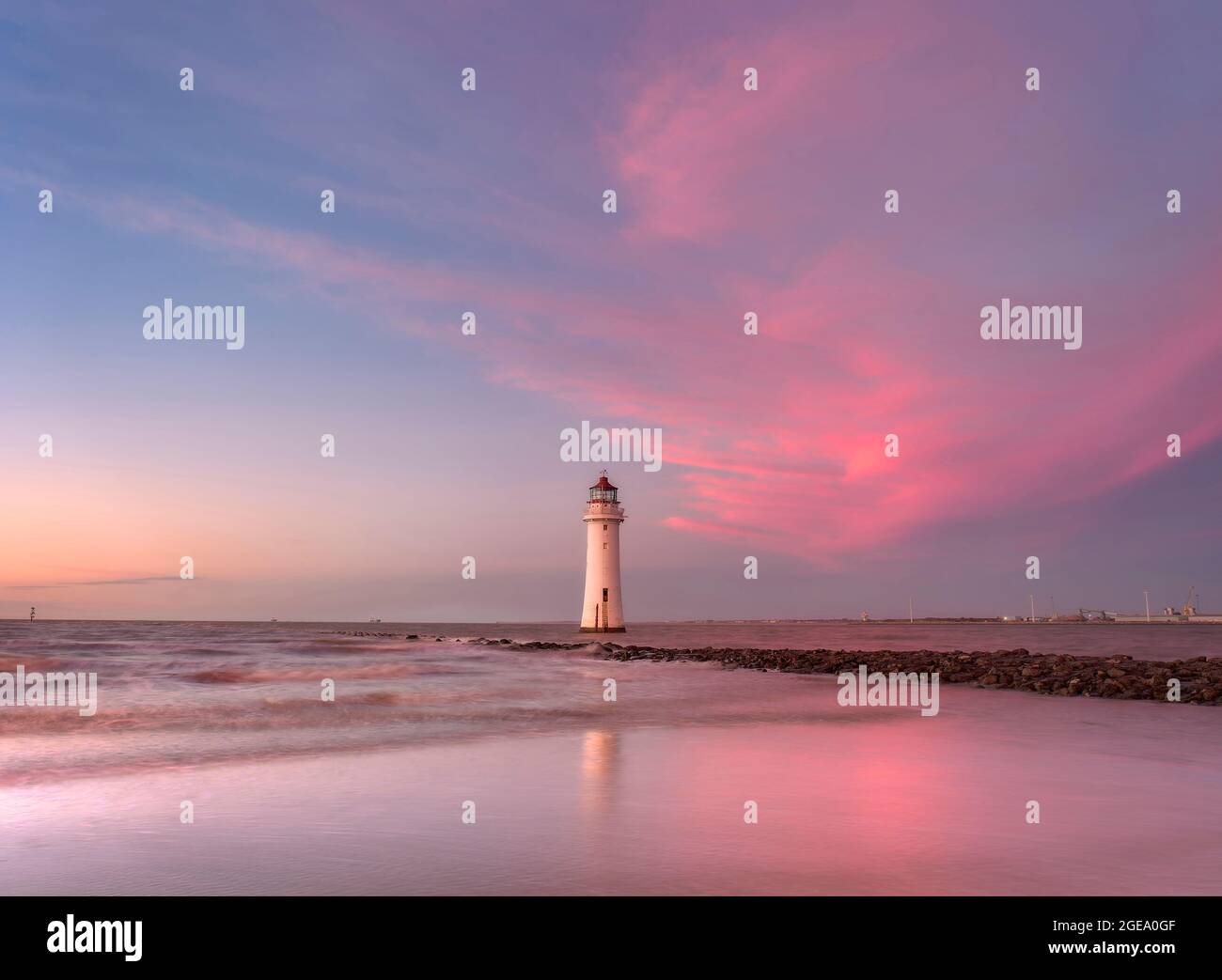 Colourful pink sunset at New Brighton Lighthouse Stock Photo - Alamy
