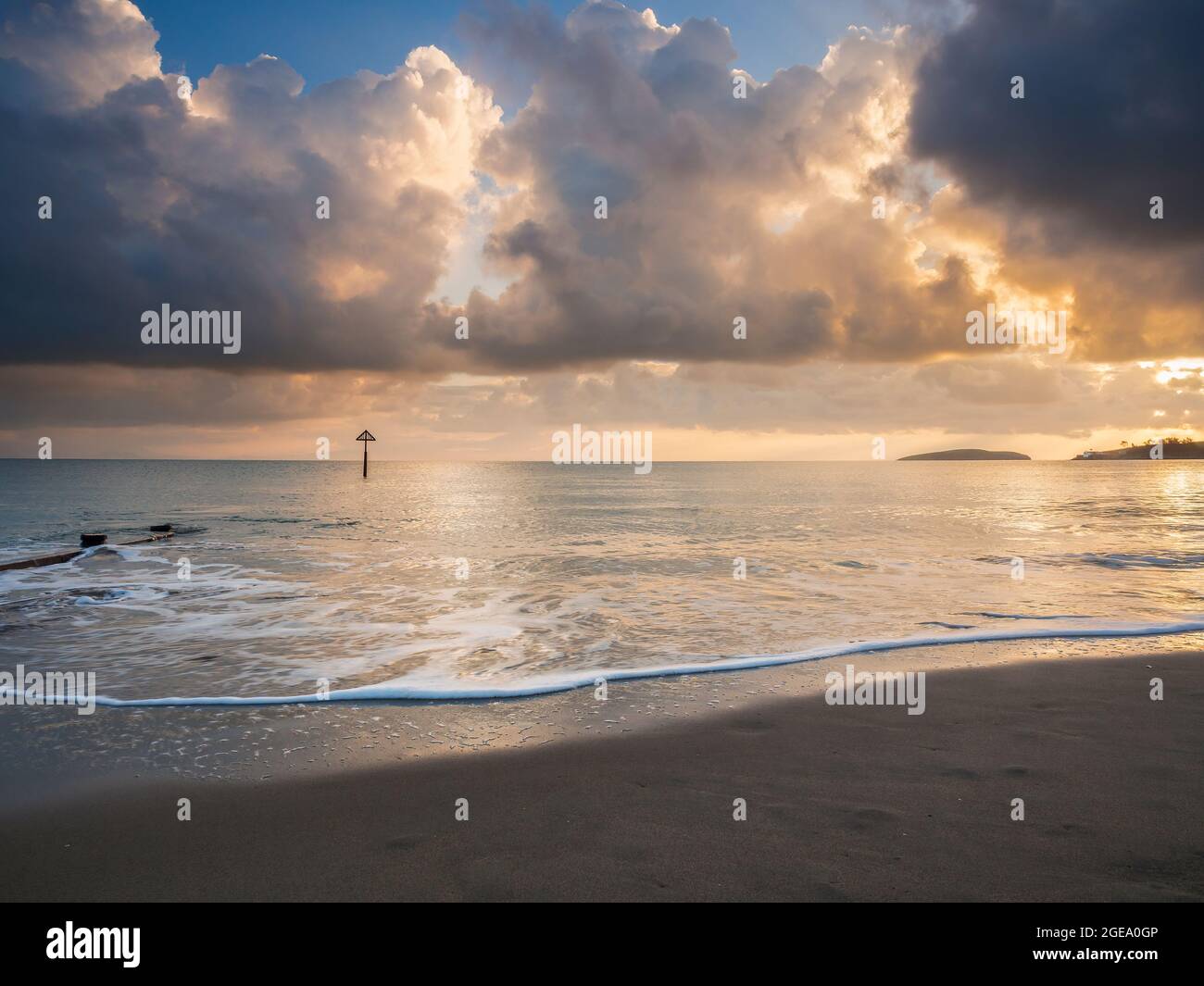 Colourful sunrise on a deserted beach Stock Photo - Alamy