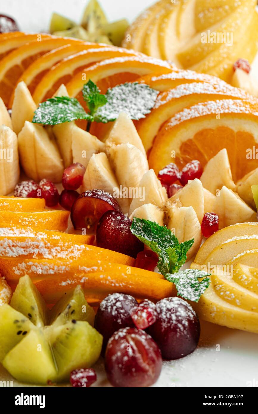 Closeup on assorted fruit plate set appetizer Stock Photo - Alamy