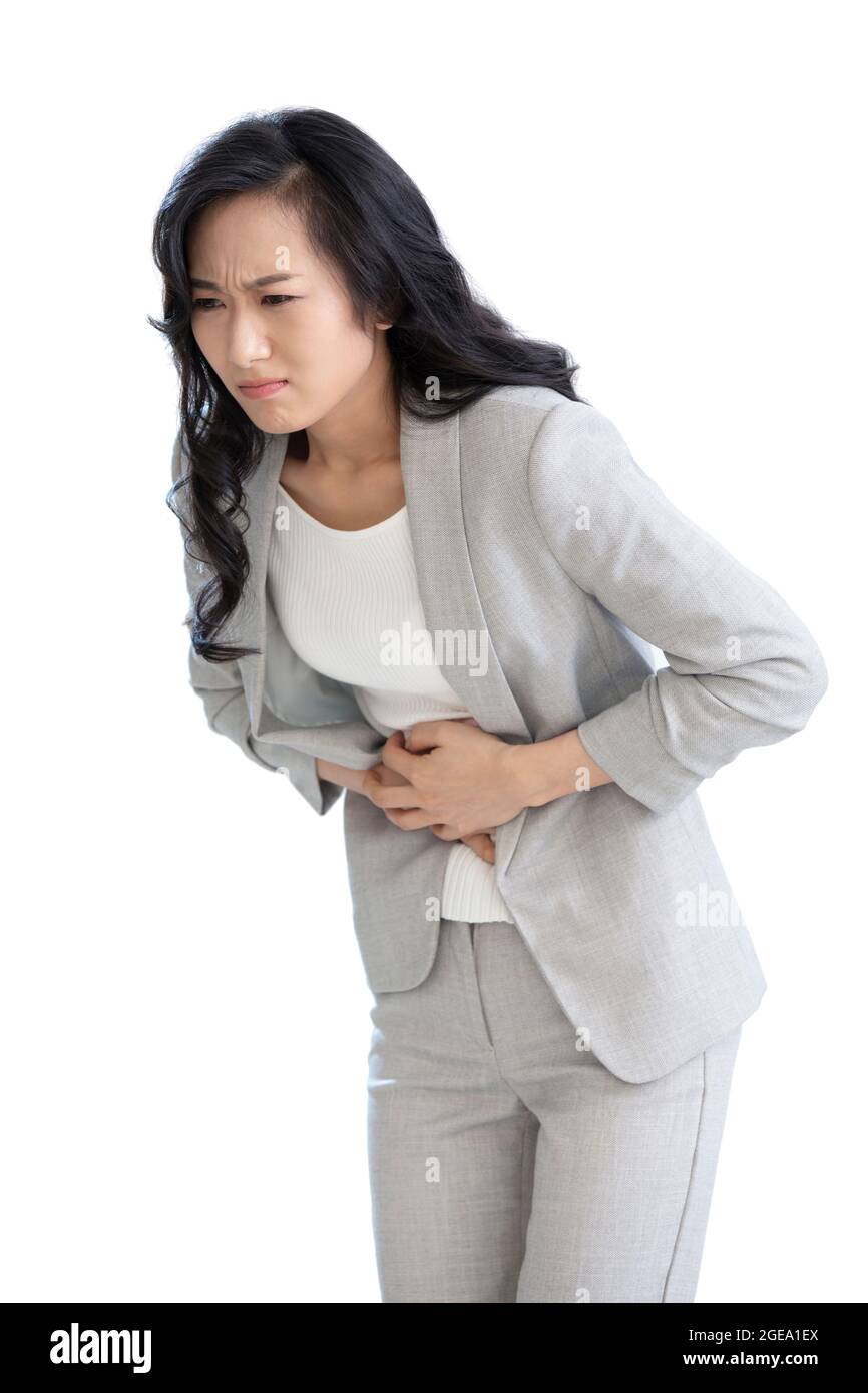 Young Chinese businesswoman with stomachache Stock Photo - Alamy