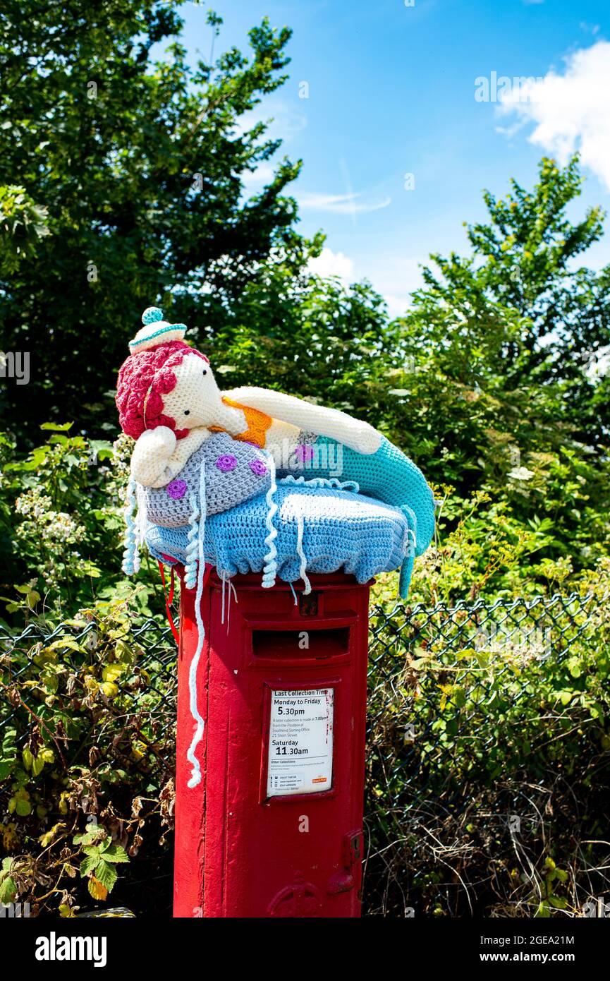 A crocheted mermaid adorns a post box at Leigh on Sea Stock Photo - Alamy