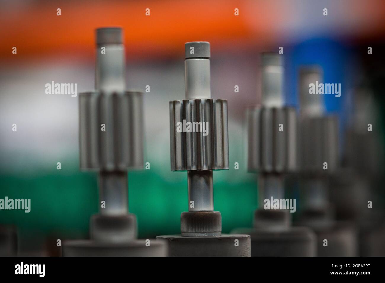 Metal precision components in a line in a workshop Stock Photo - Alamy