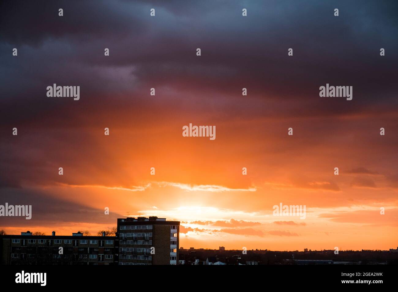 The sunset over a brooding sky Stock Photo - Alamy