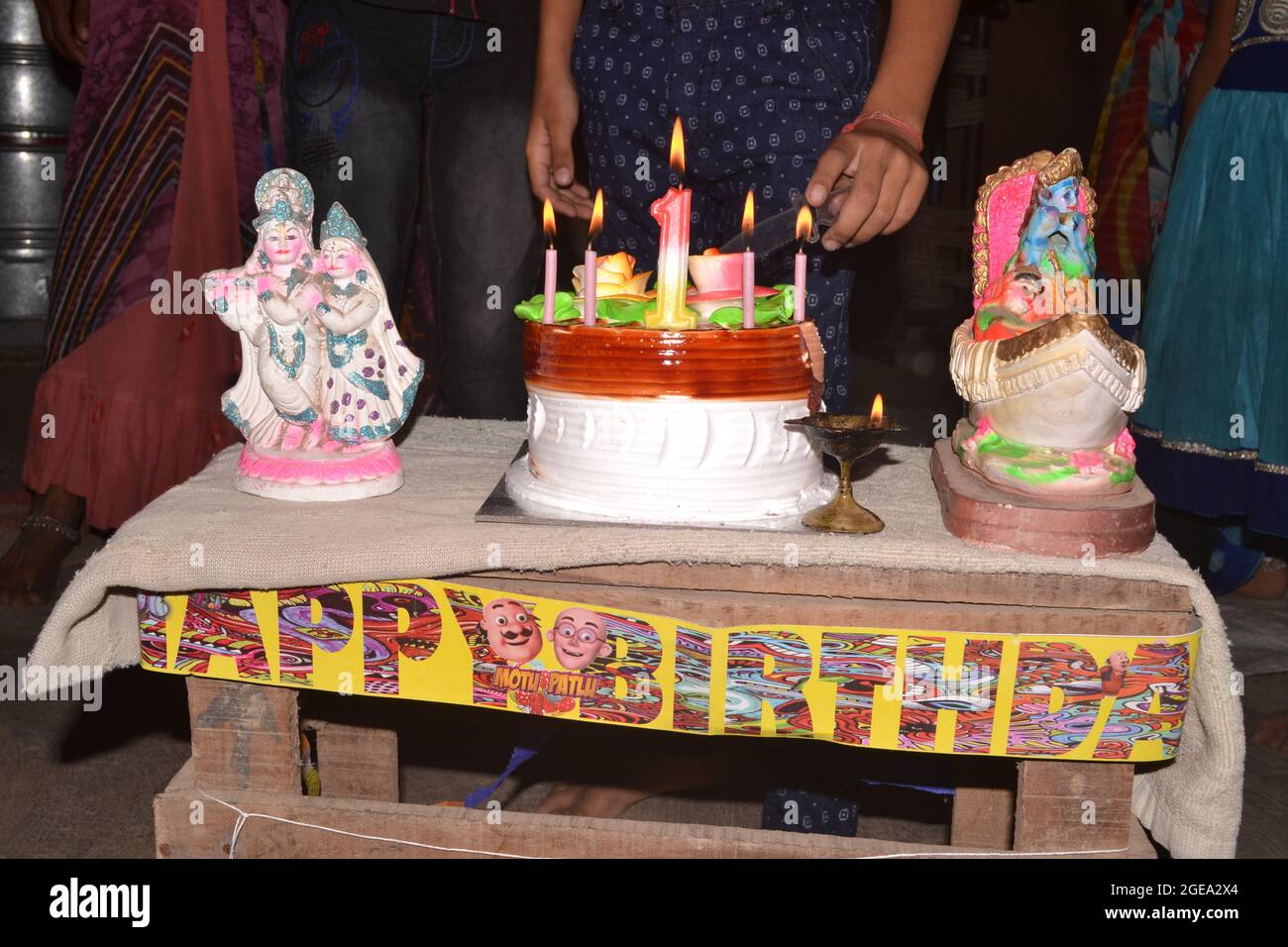 Birthday Drip Cake and burning candle with chocolate and sprinkles ...