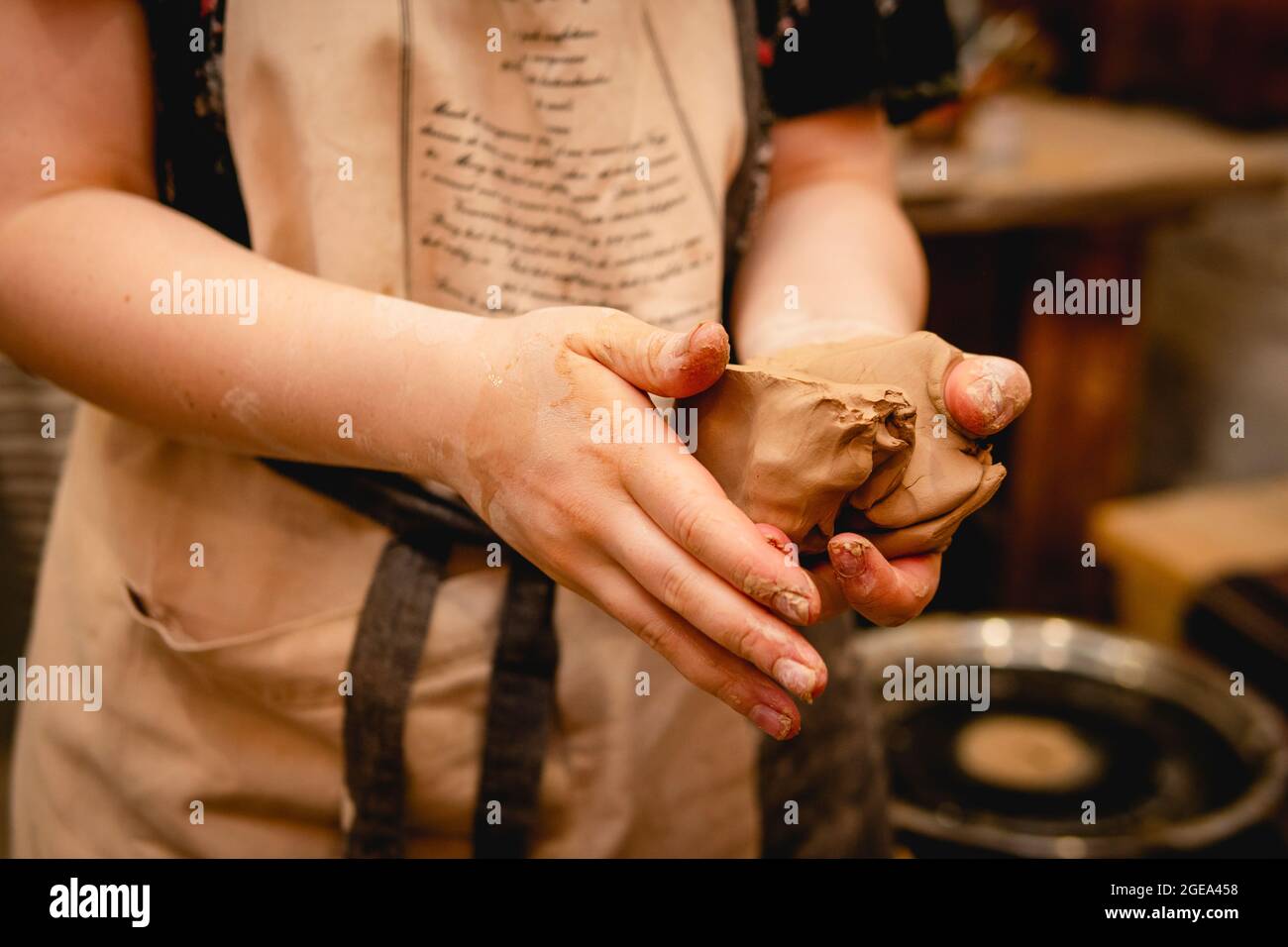 Potter working on potters wheel with clay. Process of making ceramic ...