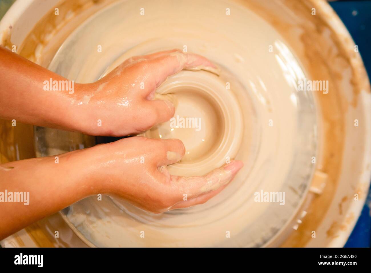 Potter working on potters wheel with clay. Process of making ceramic ...
