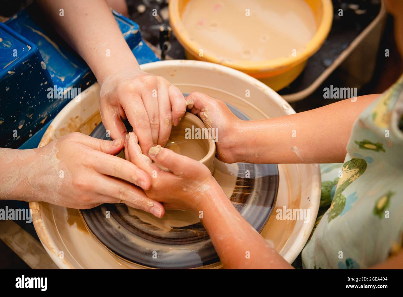 Potter working on potters wheel with clay. Process of making ceramic ...