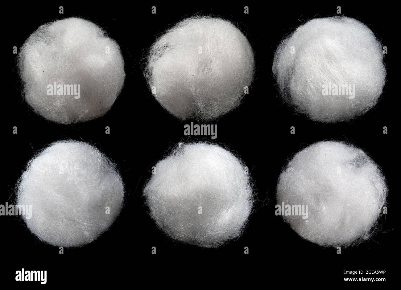 Balls of fluffy cotton wool isolated on black background Stock Photo ...