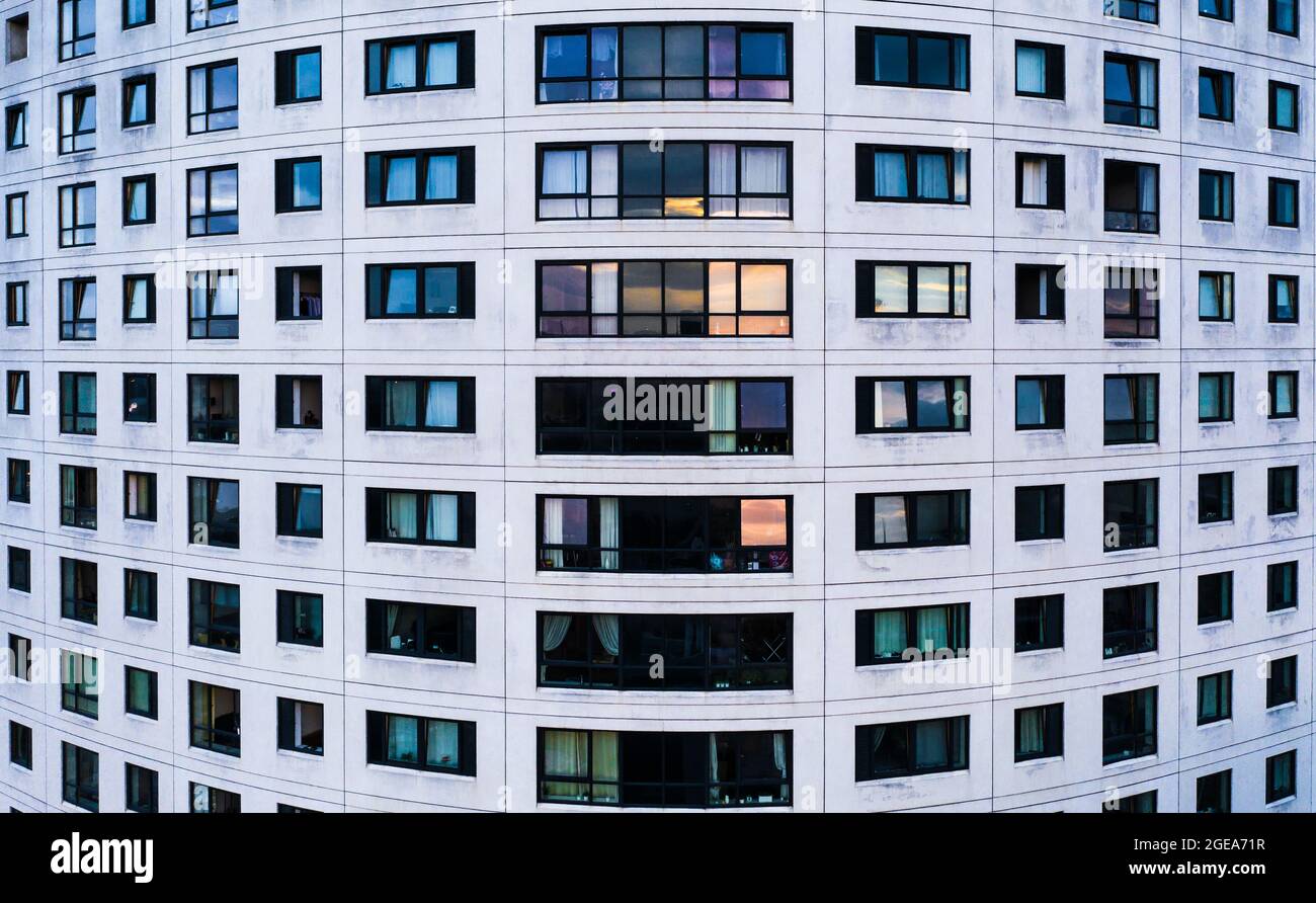 Full frame real estate background of rows of windows in a colourful ...