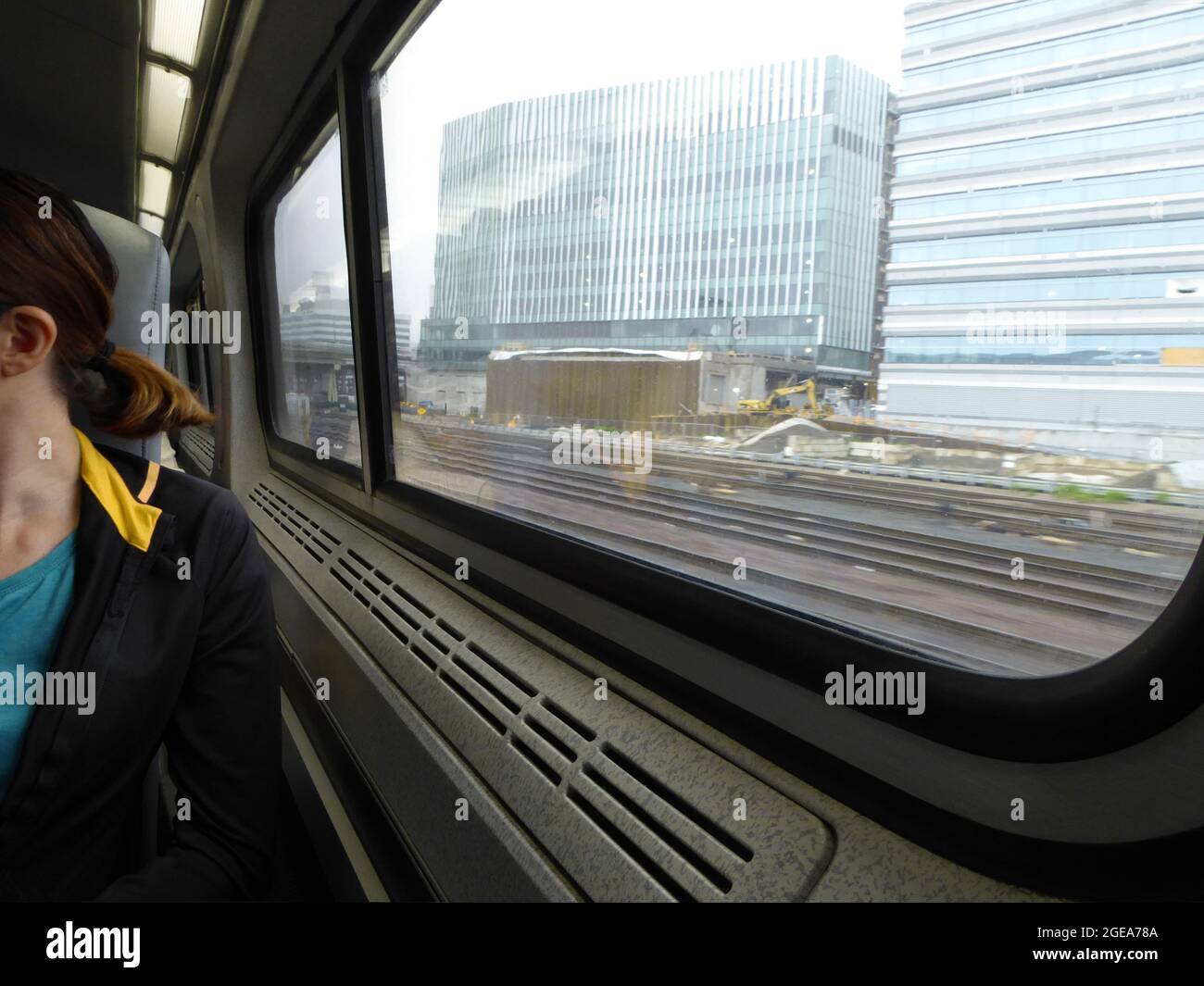 Inside of an express train. Blurred view on modern buildings from high ...