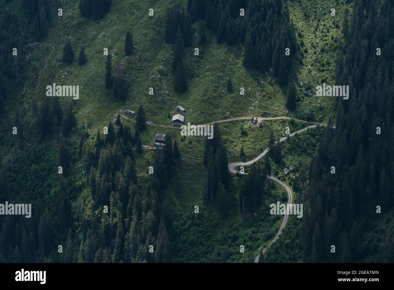 remote alpine hut on a steep slope Stock Photo - Alamy