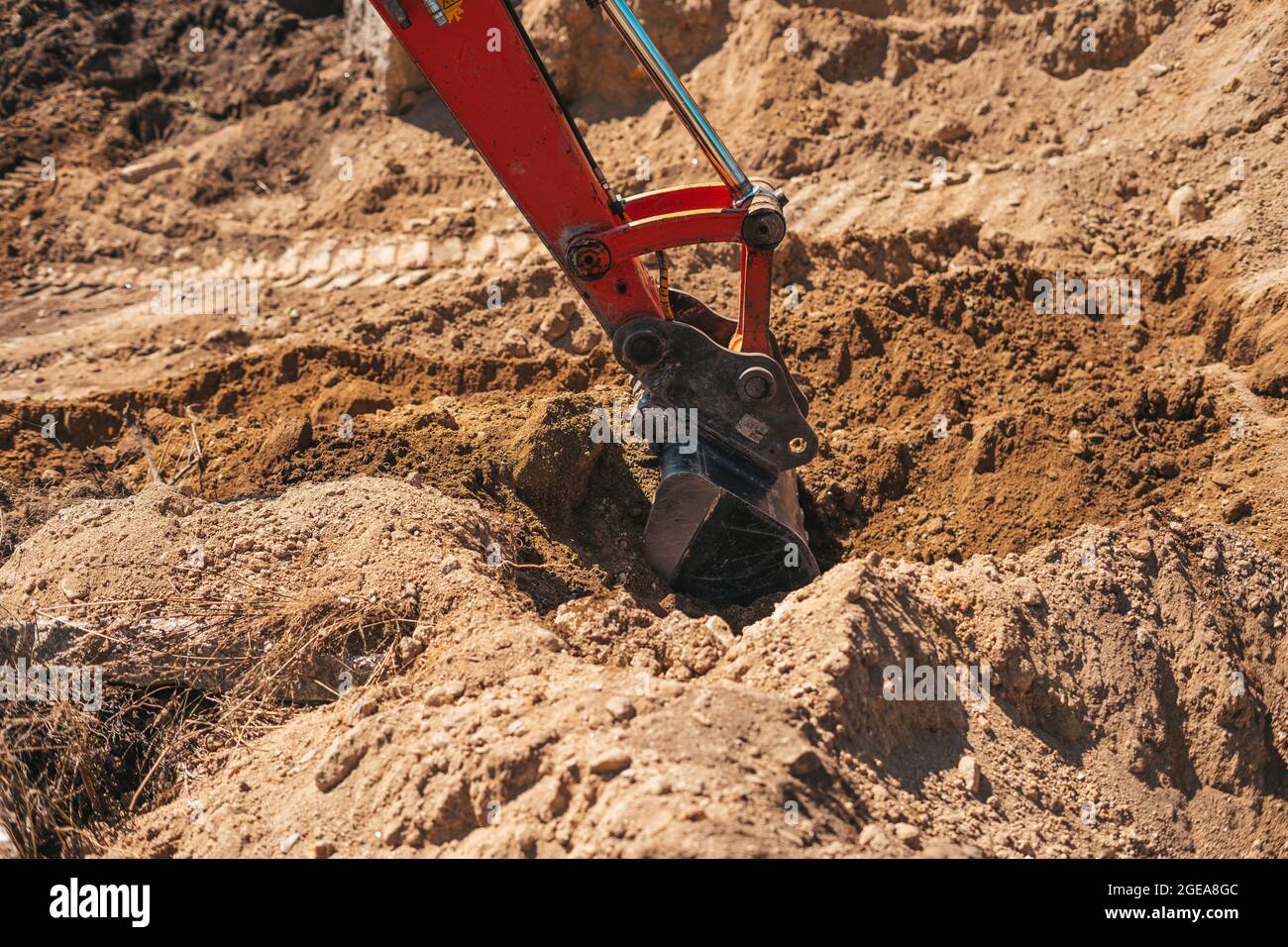 Excavator shovel digging on dirt on a construction site Stock Photo - Alamy