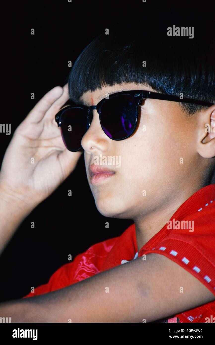 Cute little Indian Asian boy wearing spectacles Stock Photo - Alamy