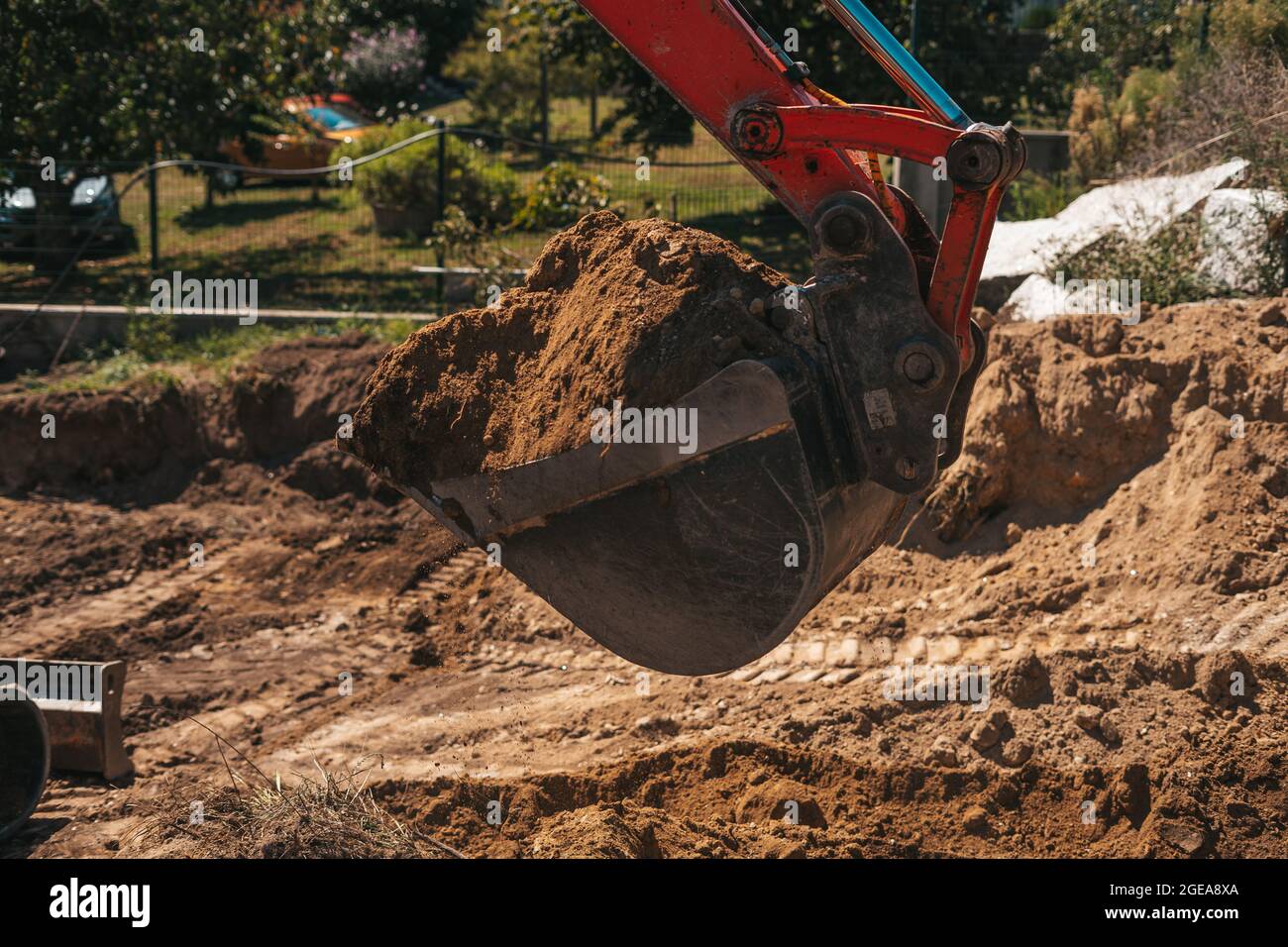 Excavator shovel digging on dirt on a construction site Stock Photo - Alamy