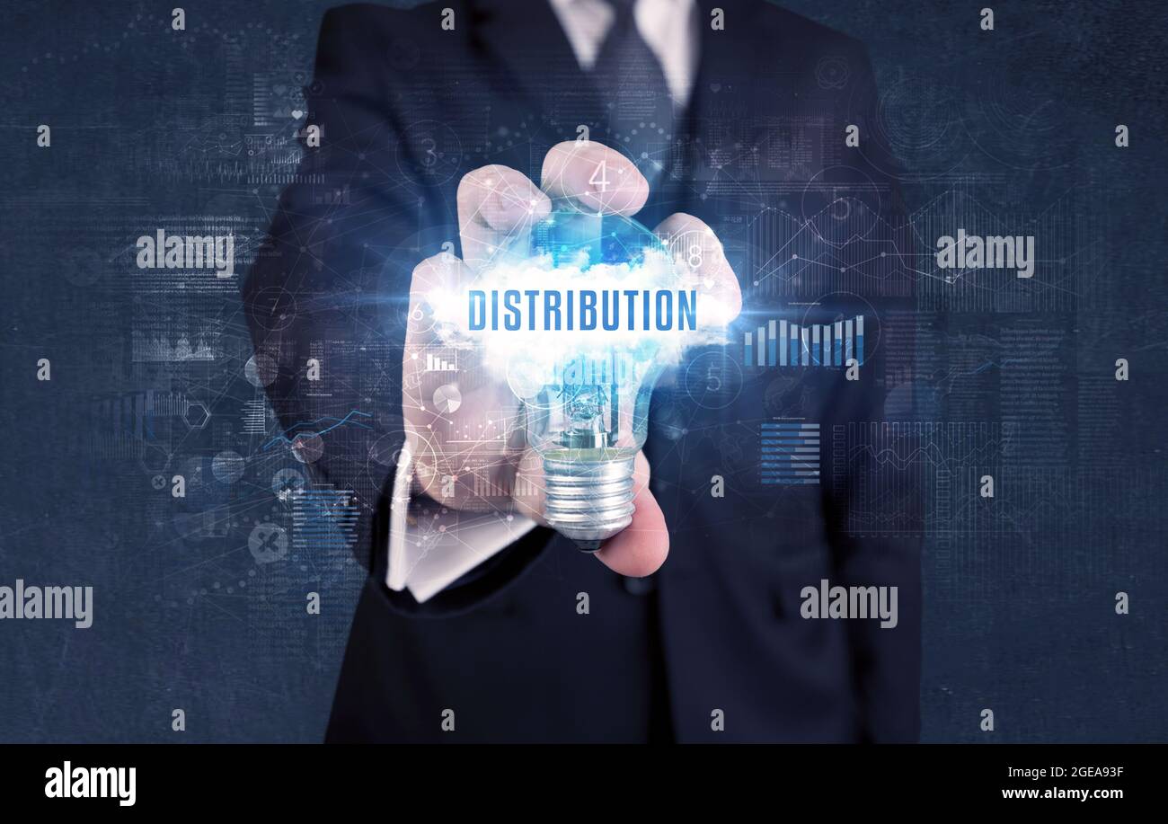 Businessman holding a light bulb, business concept Stock Photo - Alamy