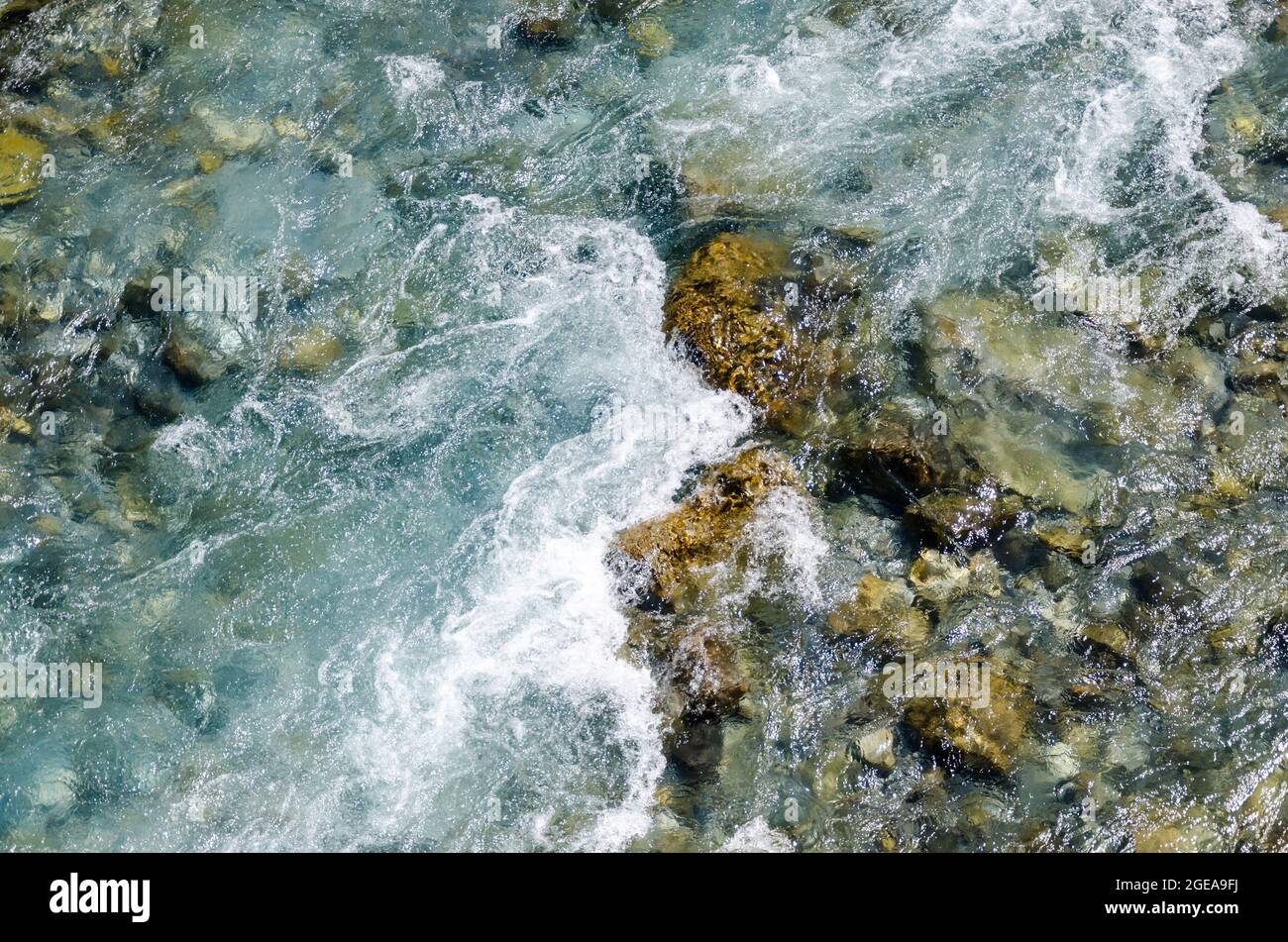 Top view of streaming river Stock Photo - Alamy