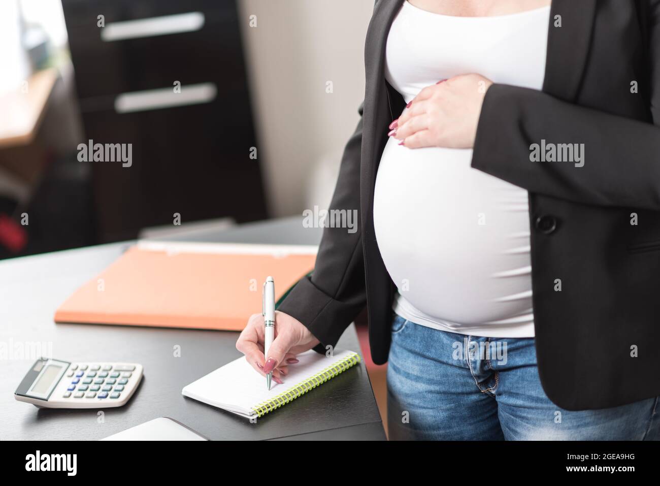 Pregnant woman taking notes hi-res stock photography and images - Alamy