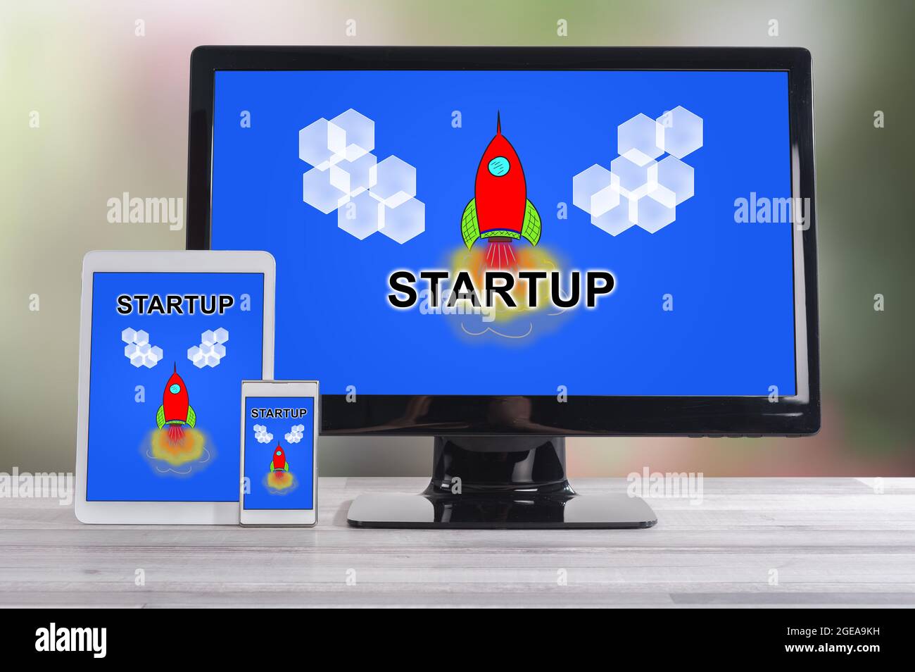 Start up concept shown on different information technology devices ...