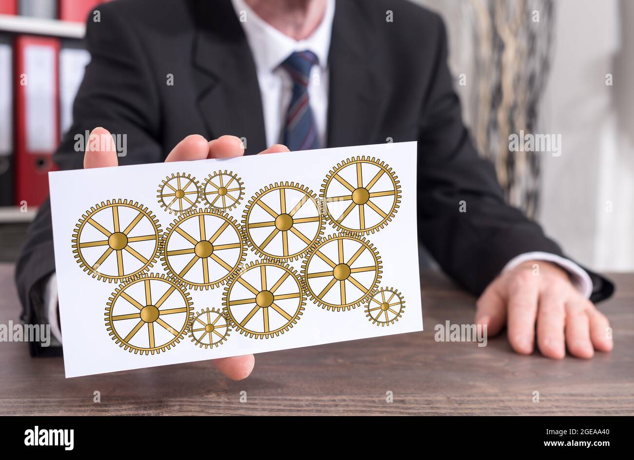 Businessman showing an index card with teamwork concept Stock Photo - Alamy