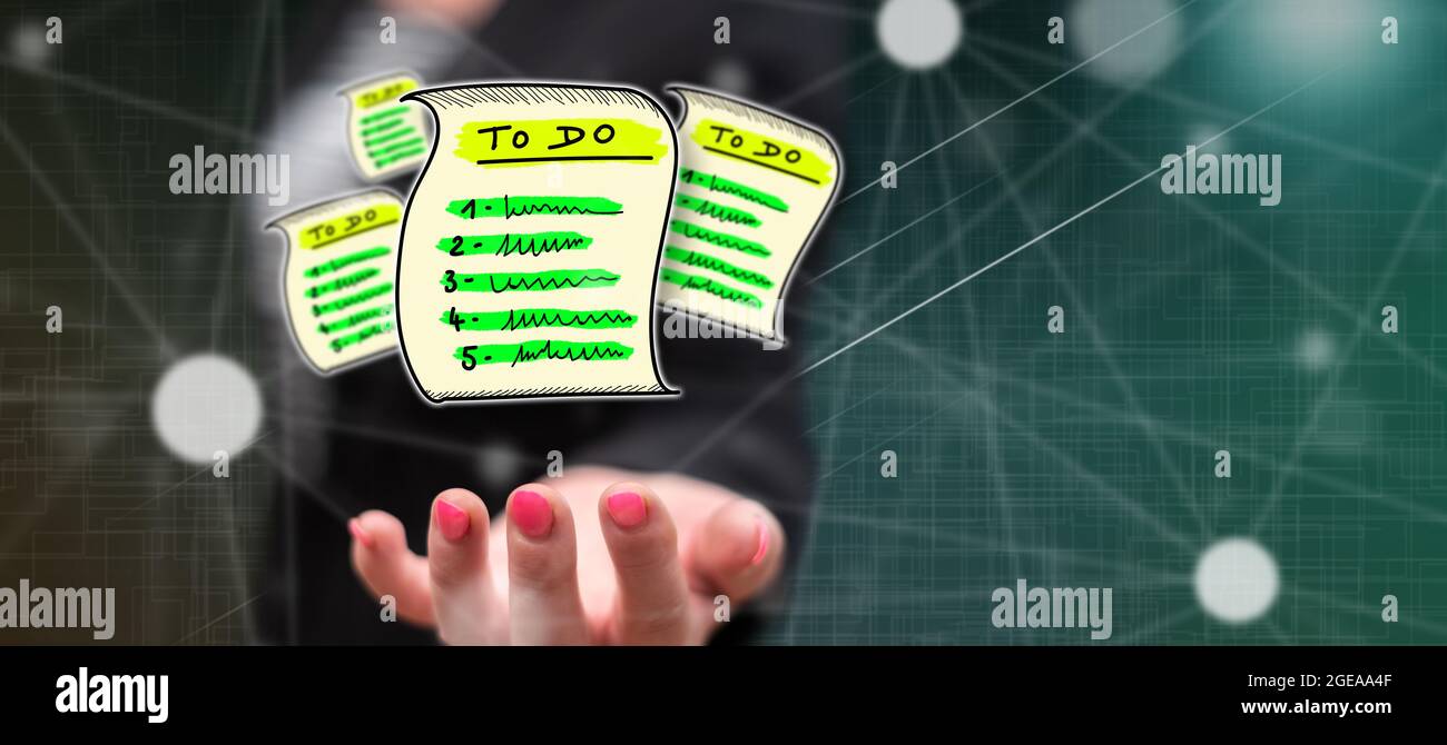 To do list concept above the hand of a woman in background Stock Photo ...