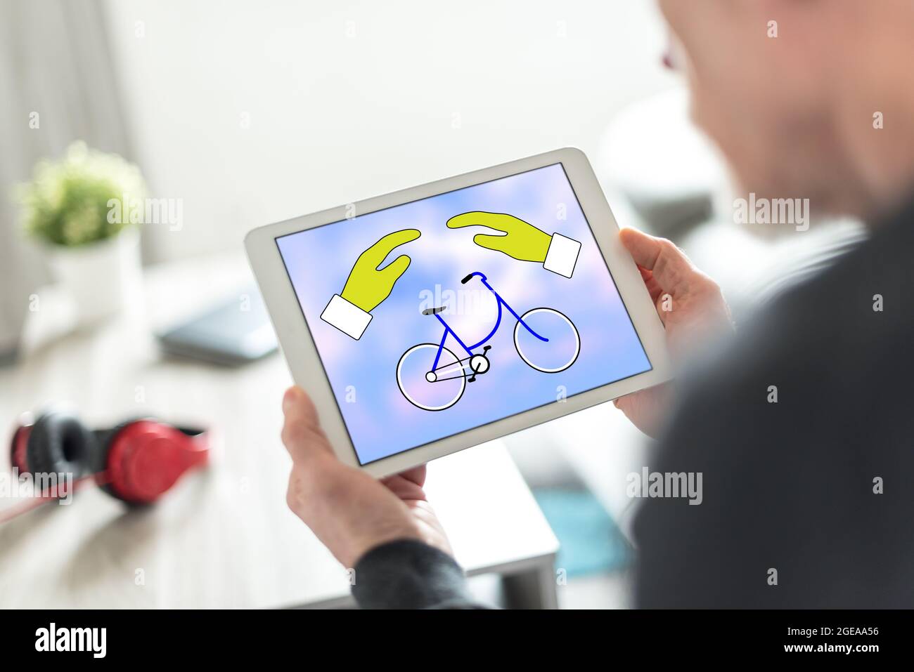 Tablet screen displaying a bicycle insurance concept Stock Photo - Alamy