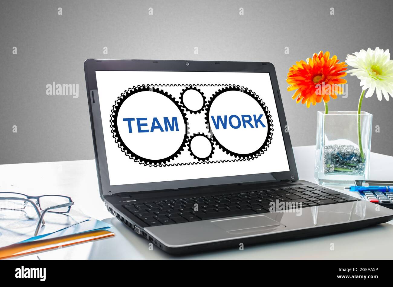 Laptop screen showing teamwork concept Stock Photo - Alamy