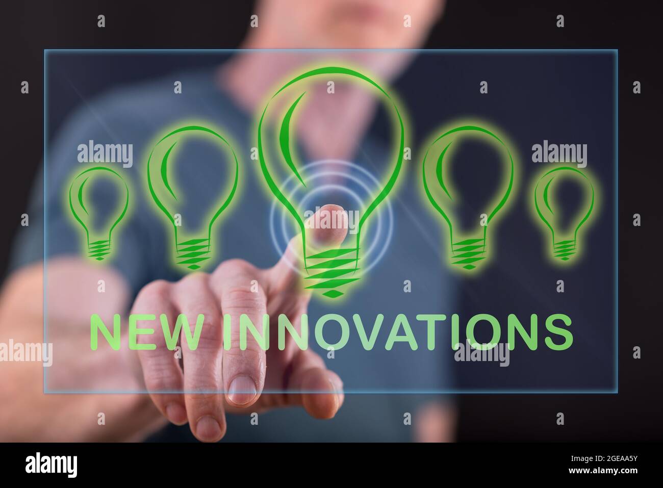 Man touching a new innovations concept on a touch screen with his ...