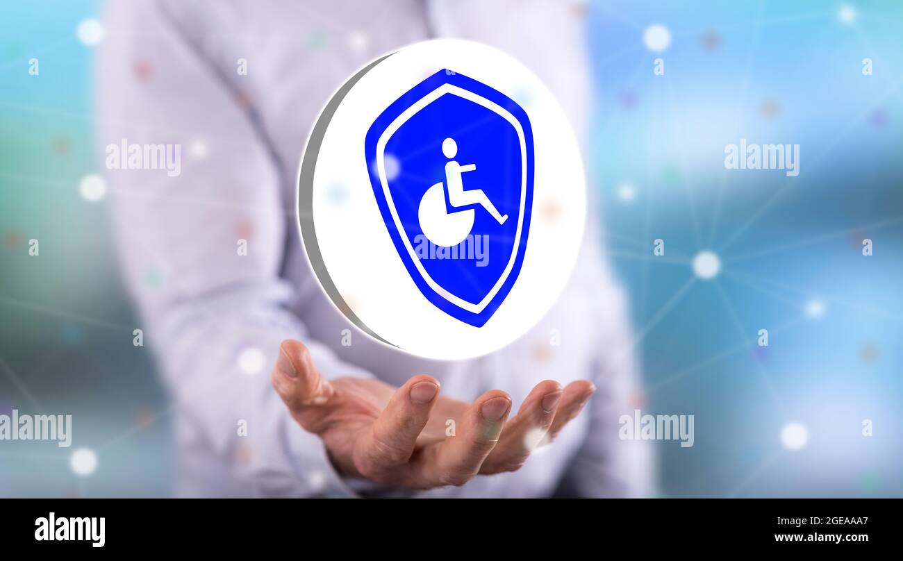 Disability insurance concept above the hand of a man in background ...
