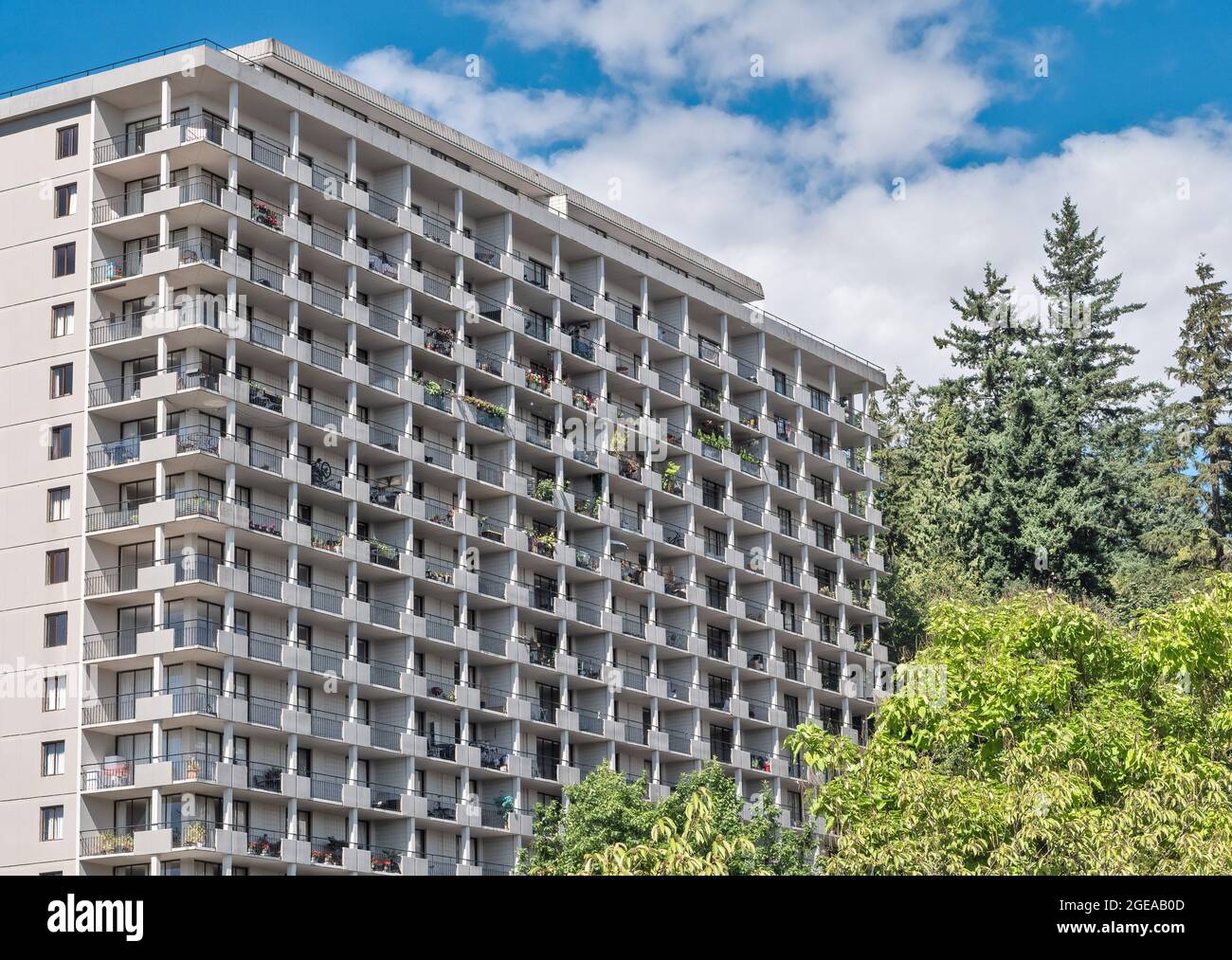 Back side of apartment residential building on blue sky background ...